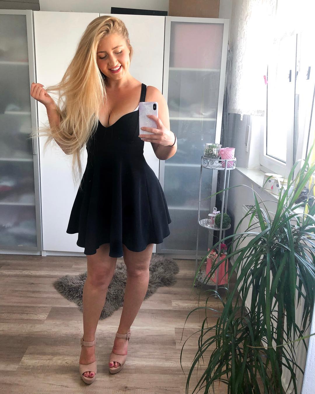 Tami does a little black dress quite nicely | Scrolller