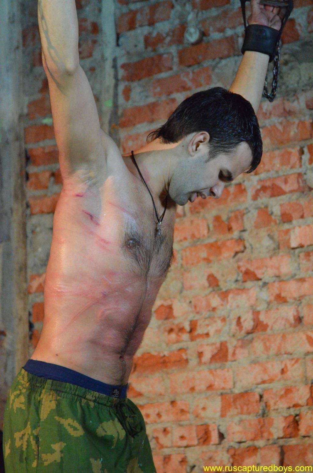 The Military Guy sweating under lashes. A pic from RusCapturedBoys.com Series “Spetsnaz Prisoner ...
