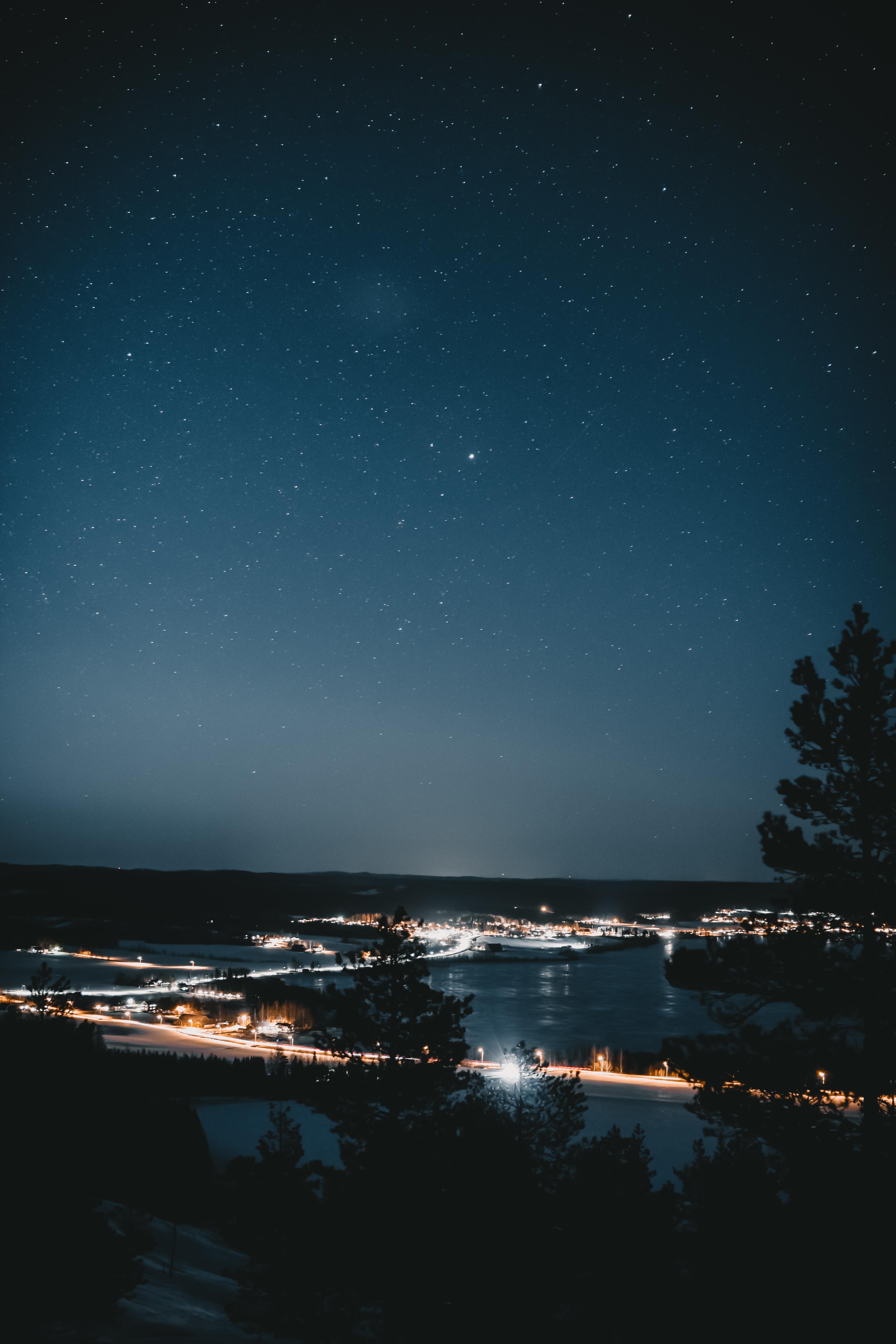 The nightsky over a small town. | Scrolller