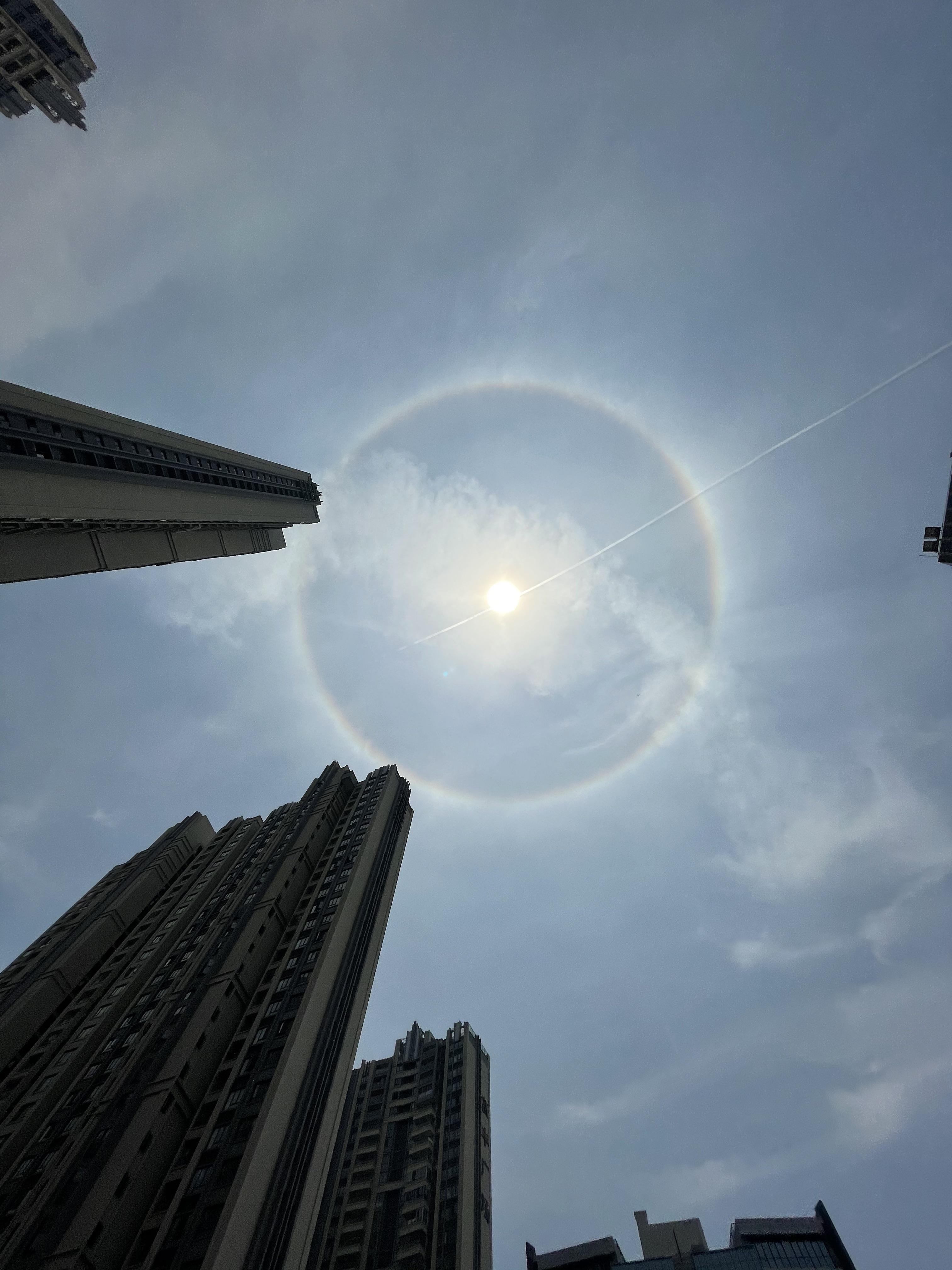 This sun halo I just saw - thin clouds that have ice crystals inside interacting with the sun ...