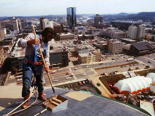 Throwback Thursday: Construction worker on-top of Sunsphere applies it’s signature gold paint ...