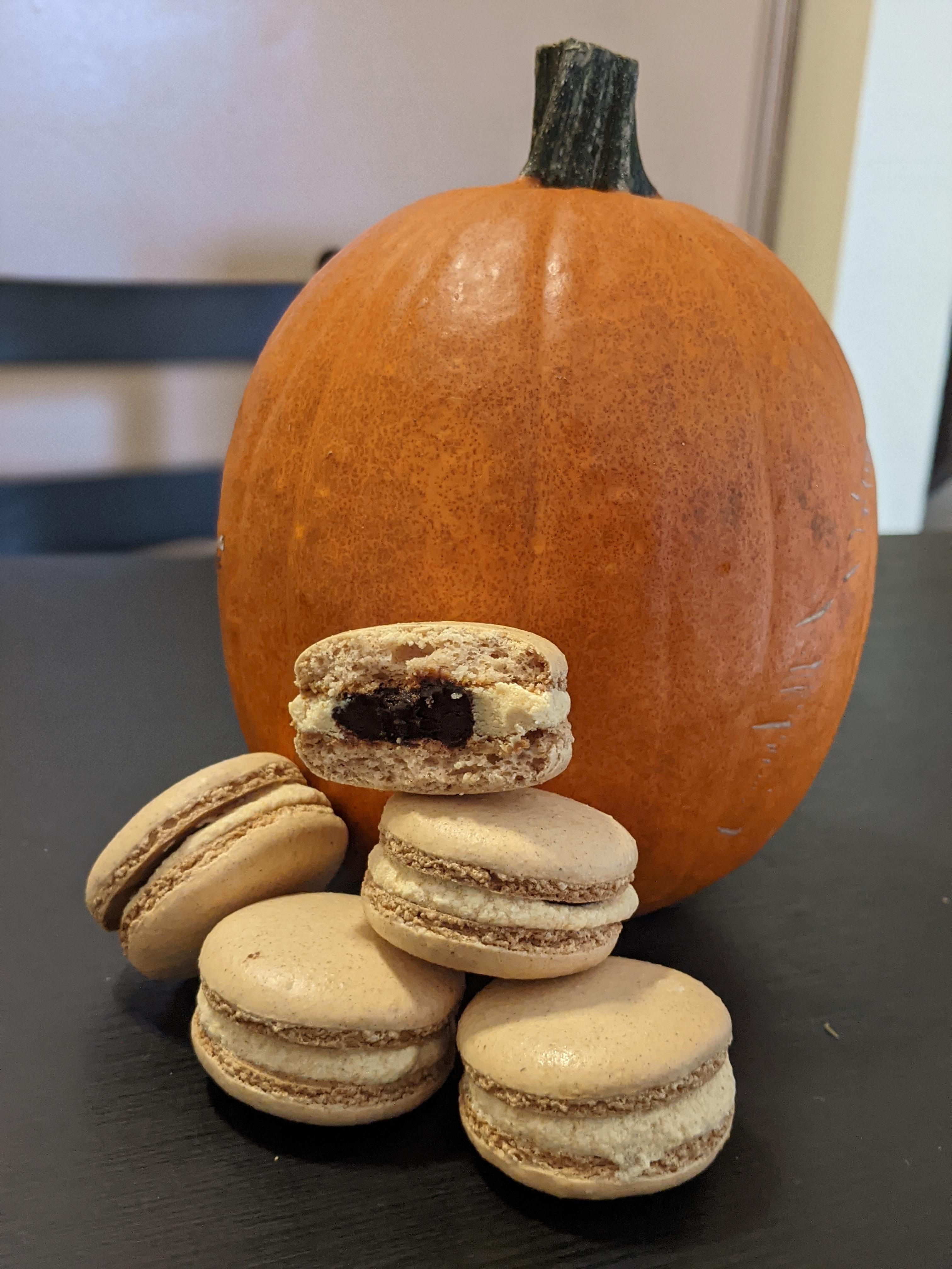 "Toasted" (aka almost burnt) pumpkin spice cheesecake macarons with chocolate centers | Scrolller