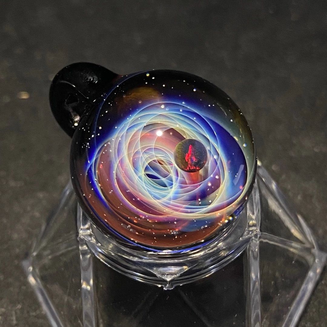 Twisted space glass sphere | Scrolller