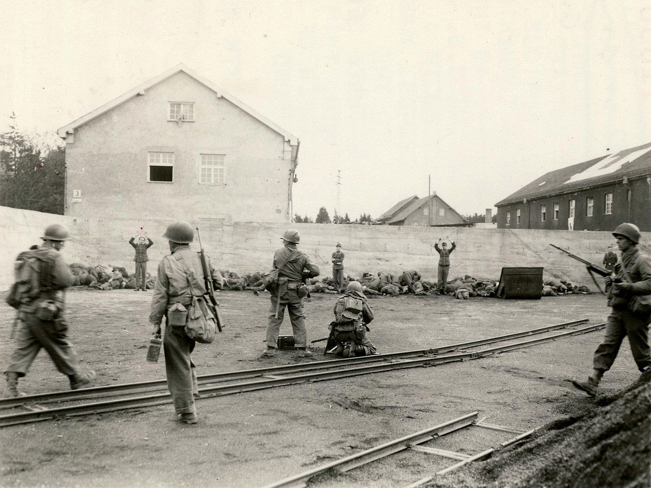 U.S. soldiers executing Waffen-SS soldiers during the liberation of Dachau, 29 April 1945 ...