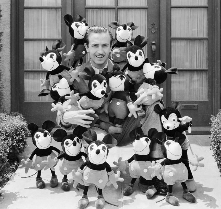 Walt Disney surrounded by Mickey plushes, 1932 | Scrolller