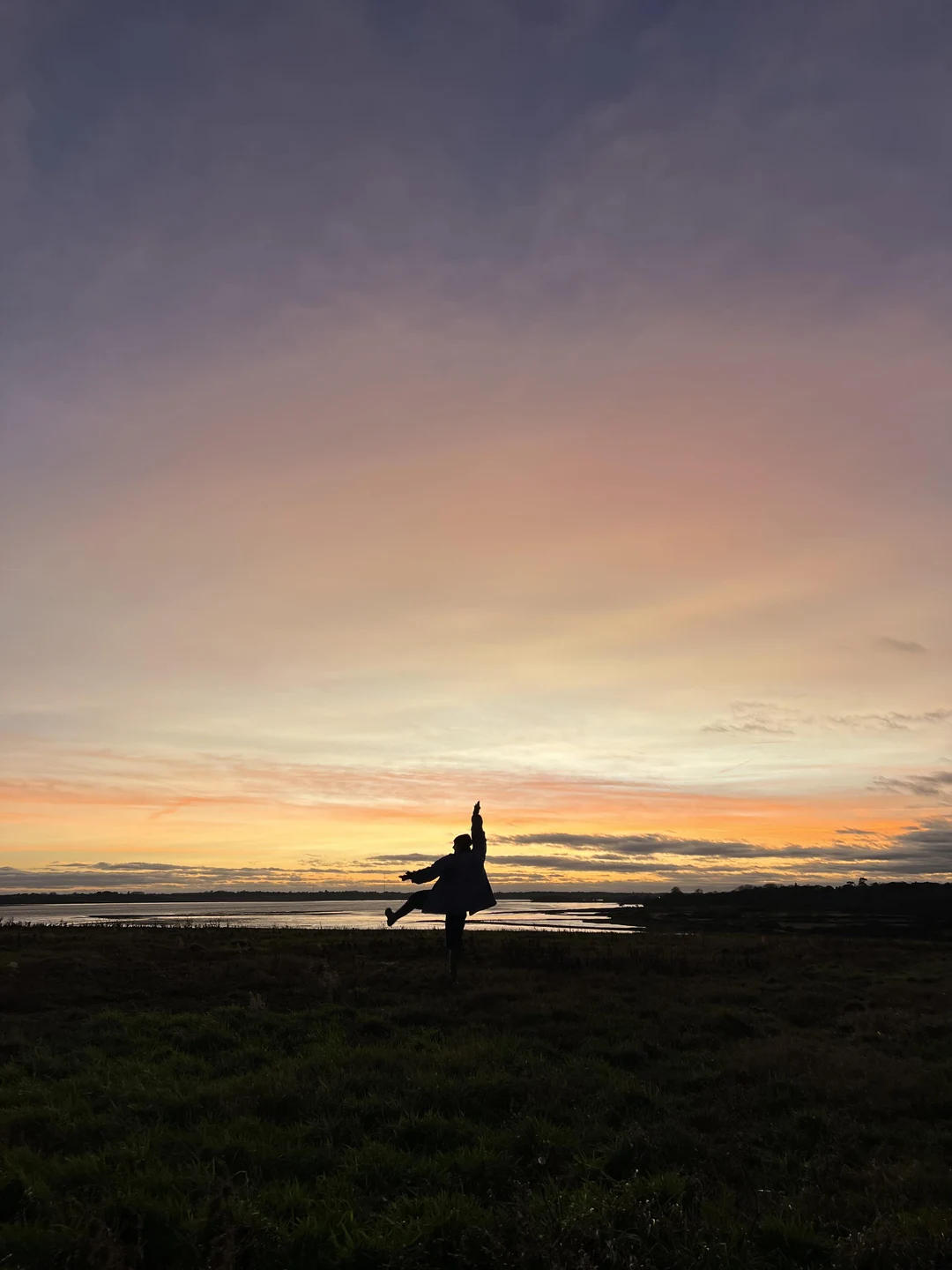 sister dancing in front of a sunset, suffolk, england | Scrolller