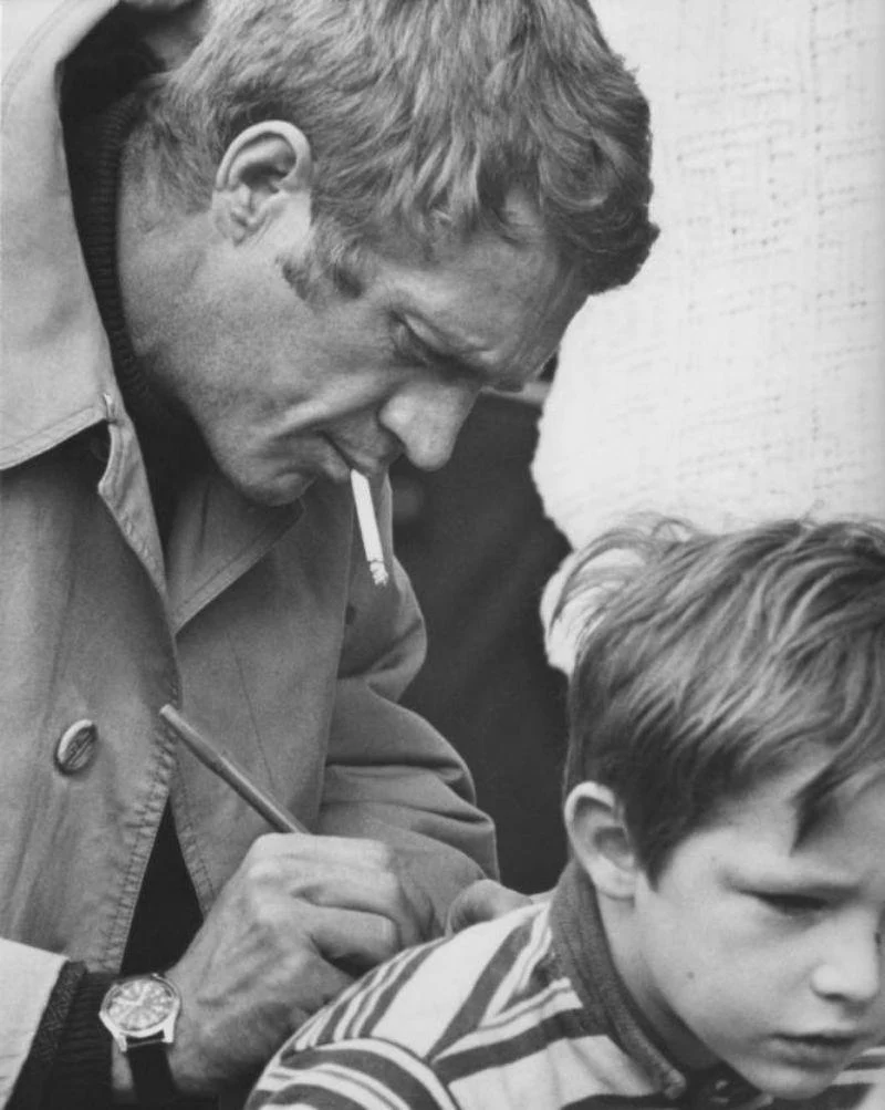 Steve McQueen signing an Autograph in 1968 | Scrolller