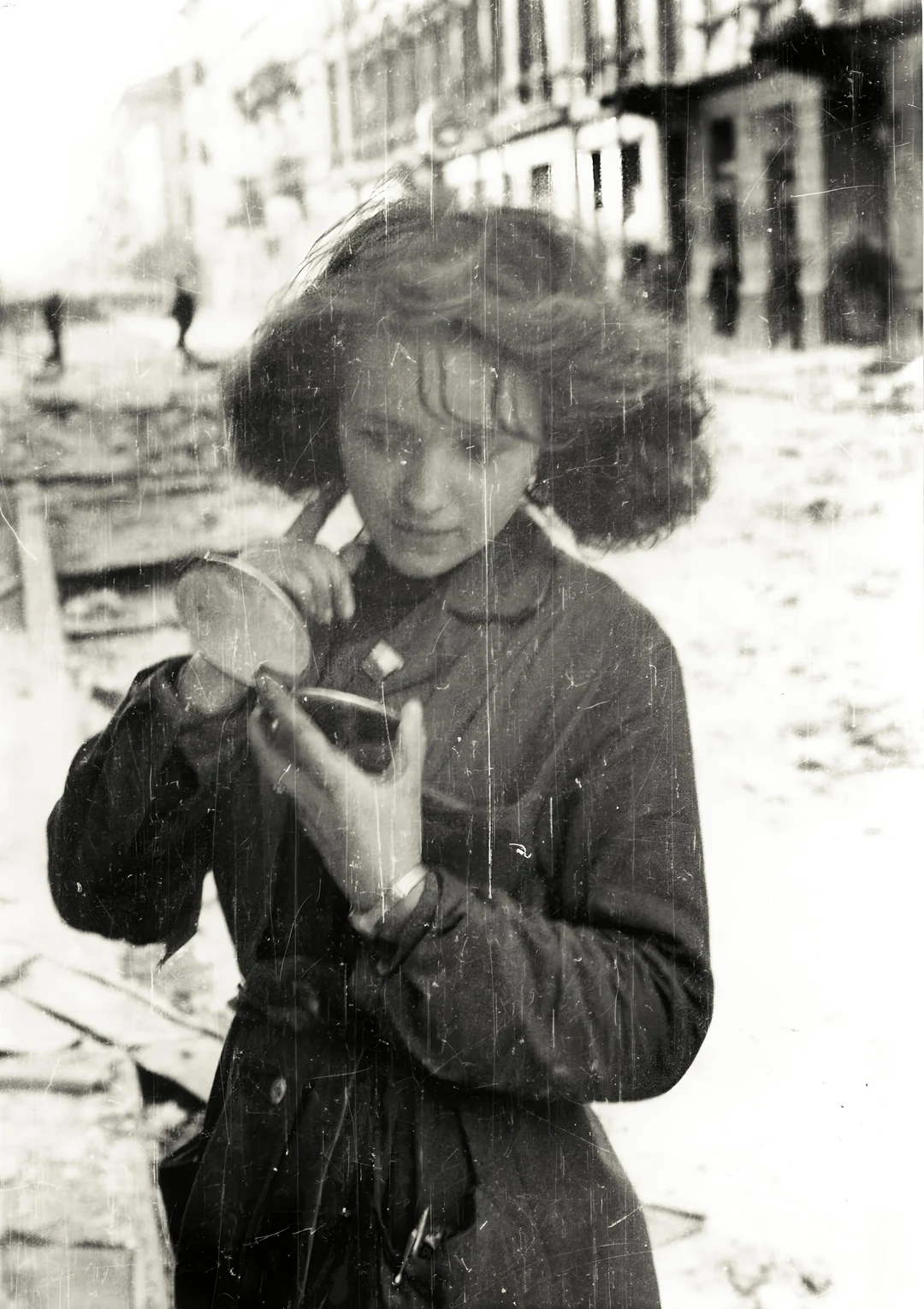 Woman with a mirror after an air raid during the horrendous 63 day Warsaw Uprising, 1944 | Scrolller