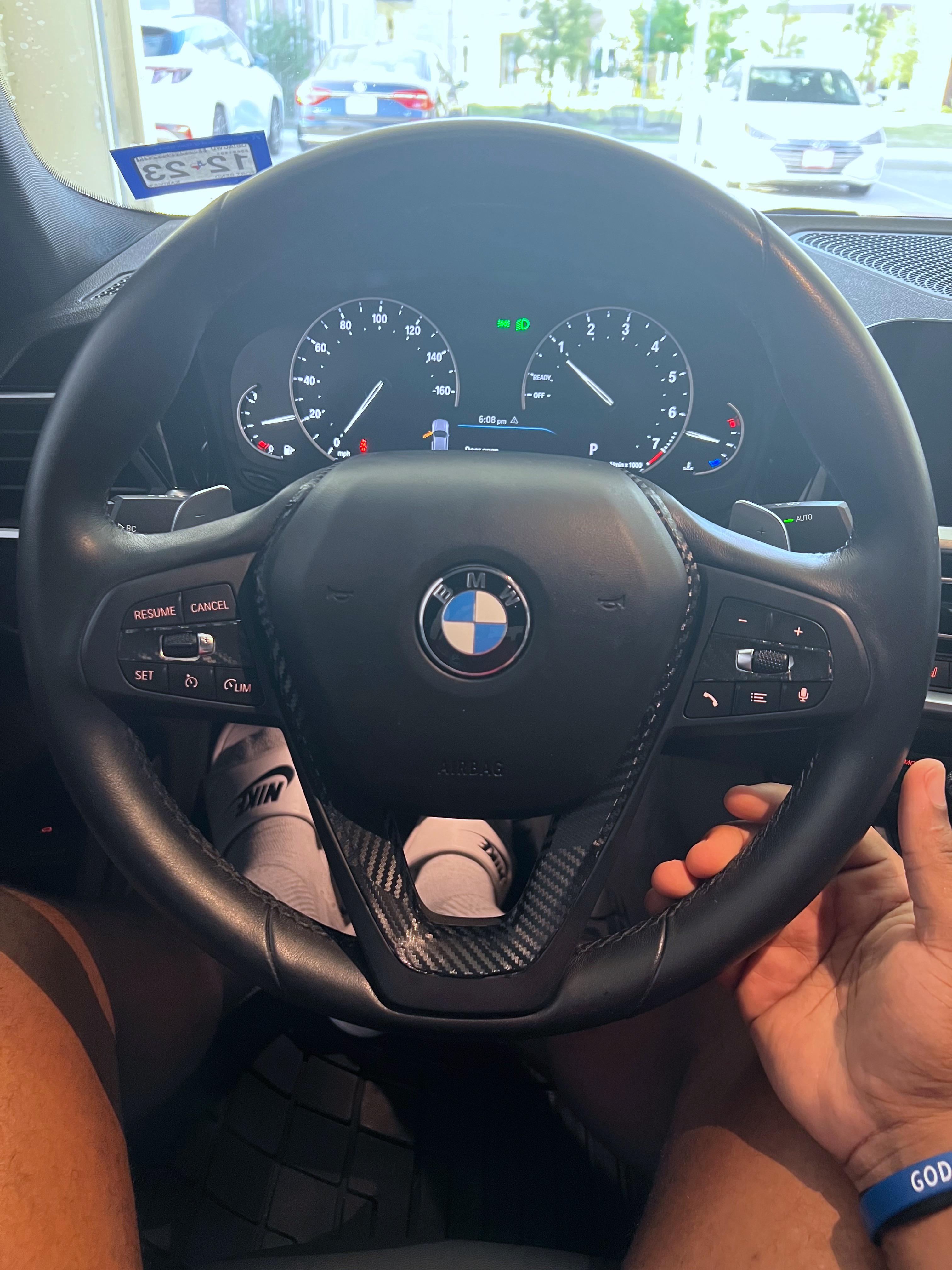 Did a chrome delete on the steering wheel of my 2019 G20 330i with a carbon fiber vinyl wrap ...