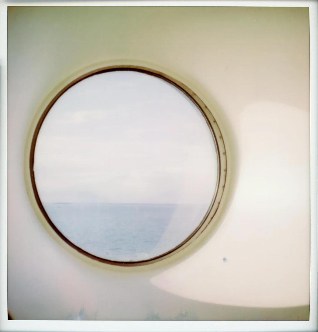 Window to the sea (converted SX-70, scanned in empty cartridge to avoid Newton's rings) | Scrolller