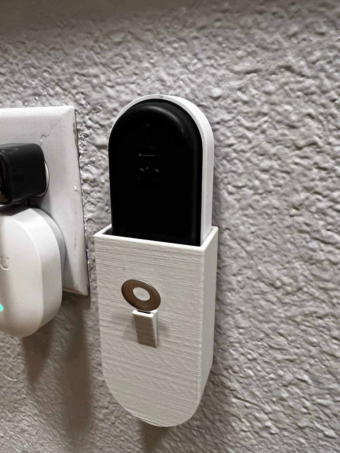 My first functional print! Designed a holder to make charging my Nest doorbell a little easier ...