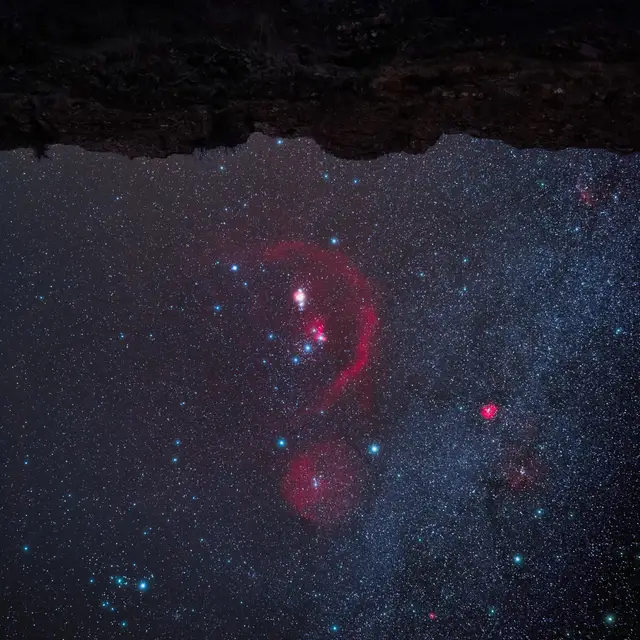Upside down photo of the Orion Constellation. The big question mark shape is known as "Barnard's ...