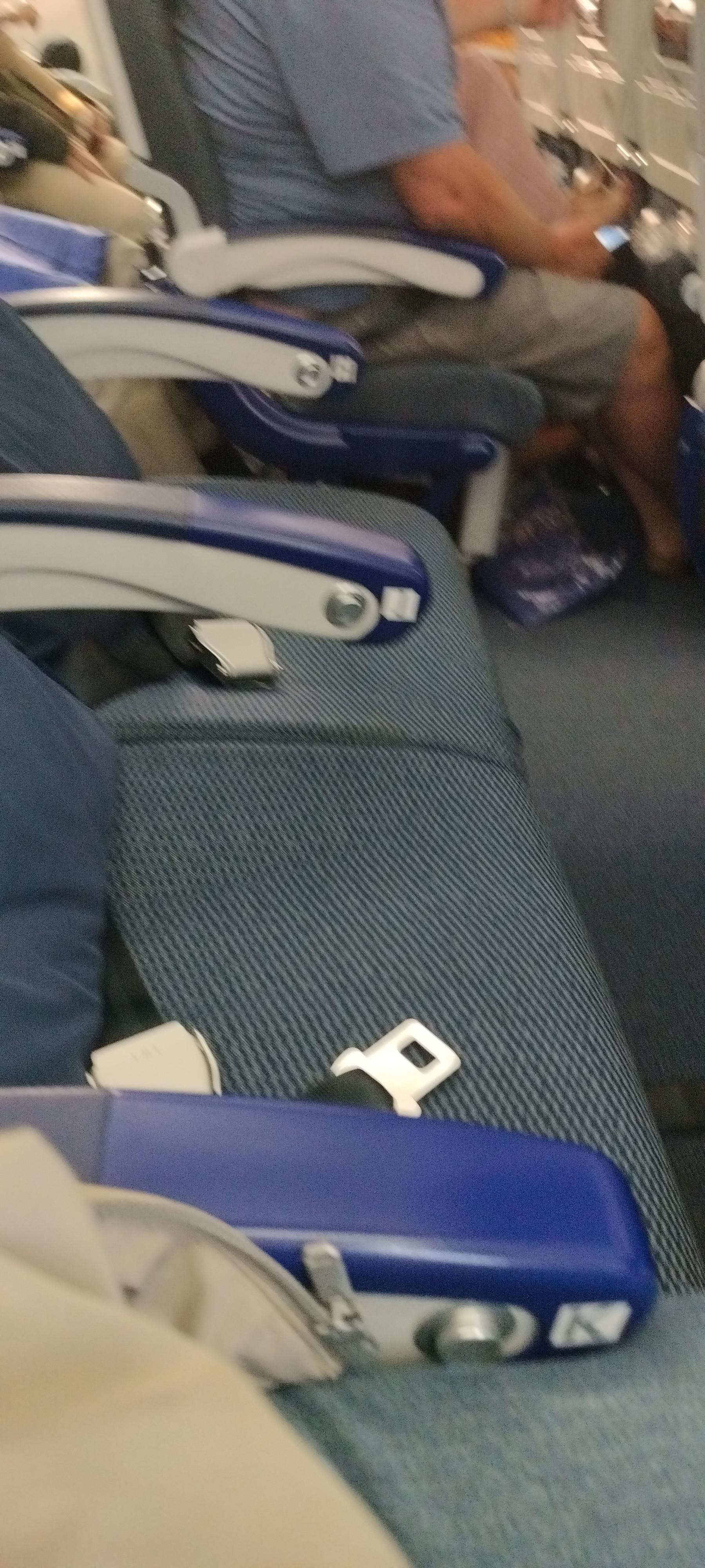 In a mostly full flight but the seats next to me are empty | Scrolller