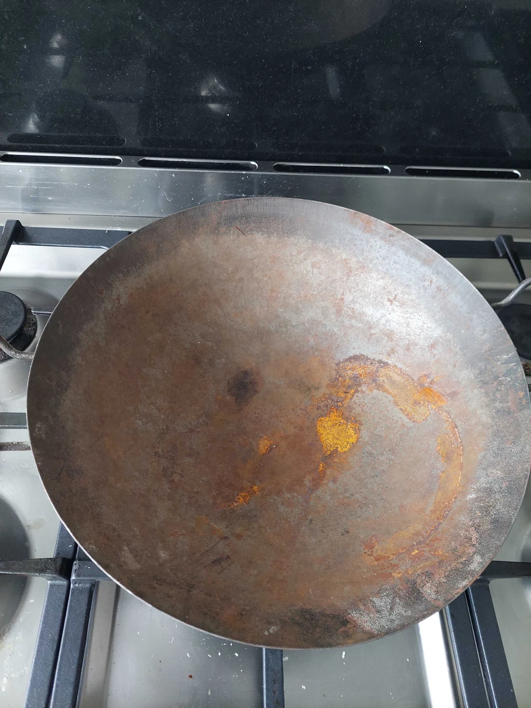I got a rusty cast iron wok from my brother in laws parents, is it fixable and how should I do ...