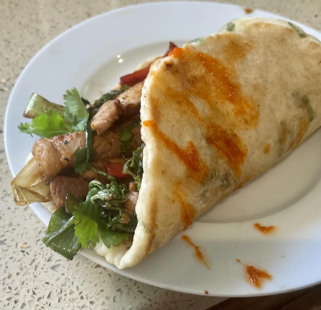 My twist on a Banh Mi—but with iron skillet leavened scallion flatbread | Scrolller