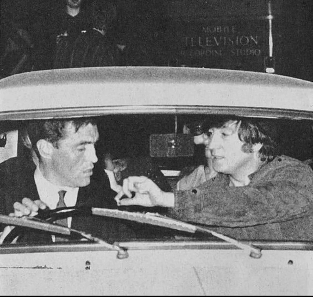 Lennon passing a joint to his chauffeur, 1965 | Scrolller
