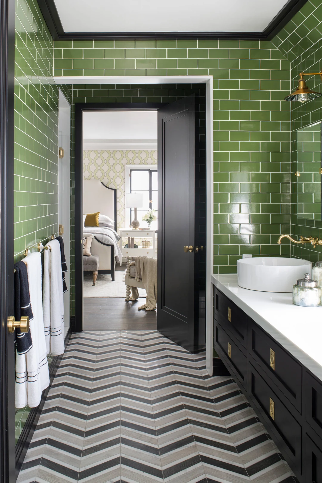 Green subway tiled bathroom with patterned porcelain tile floors in a renovated residence, Los ...