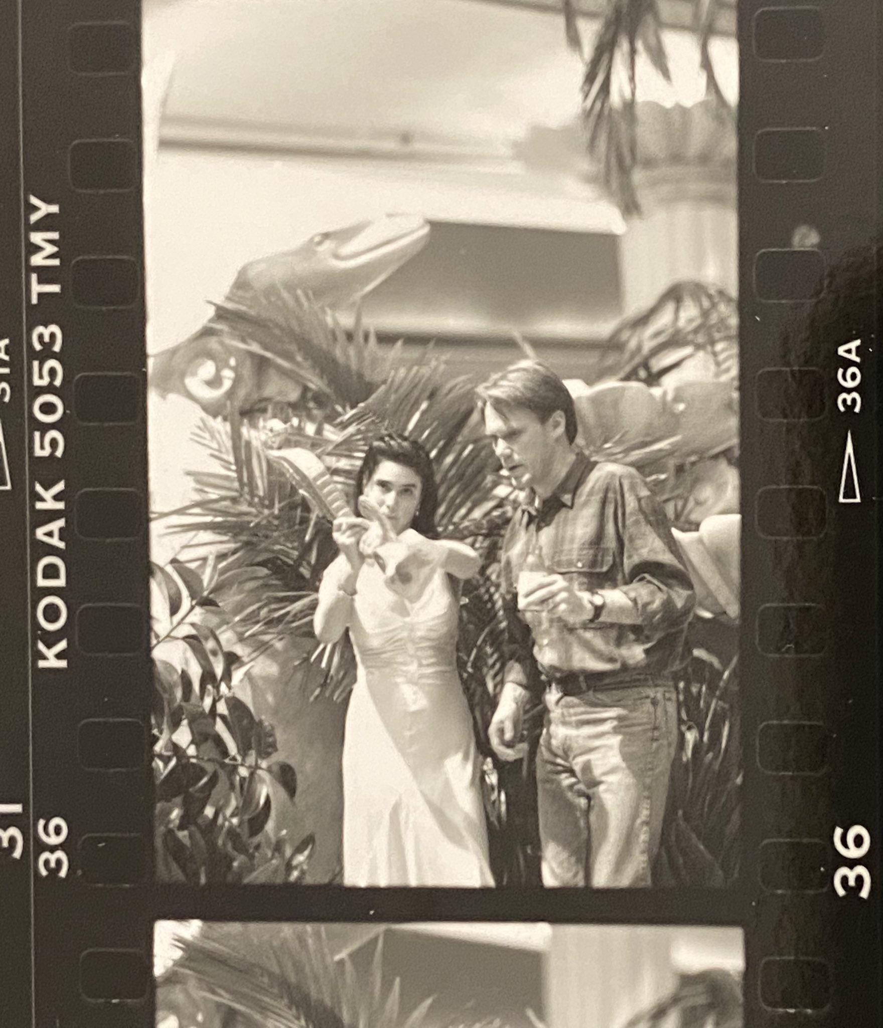 Behind the scenes photo of Jennifer Connelly and director Joe Johnston on The Rocketeer set ...