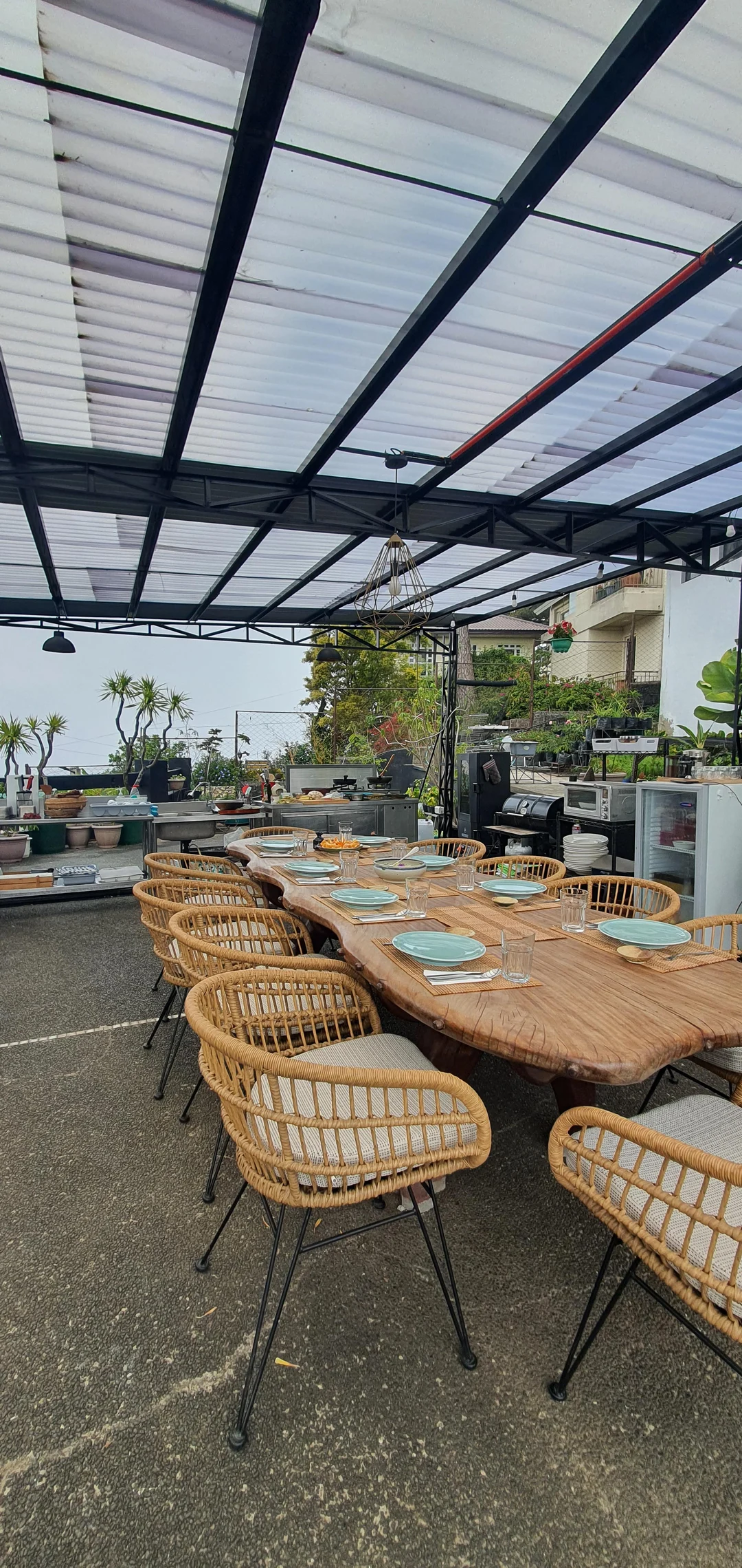 outdoor kitchen and dining area of a chef's home in the mountains | Scrolller