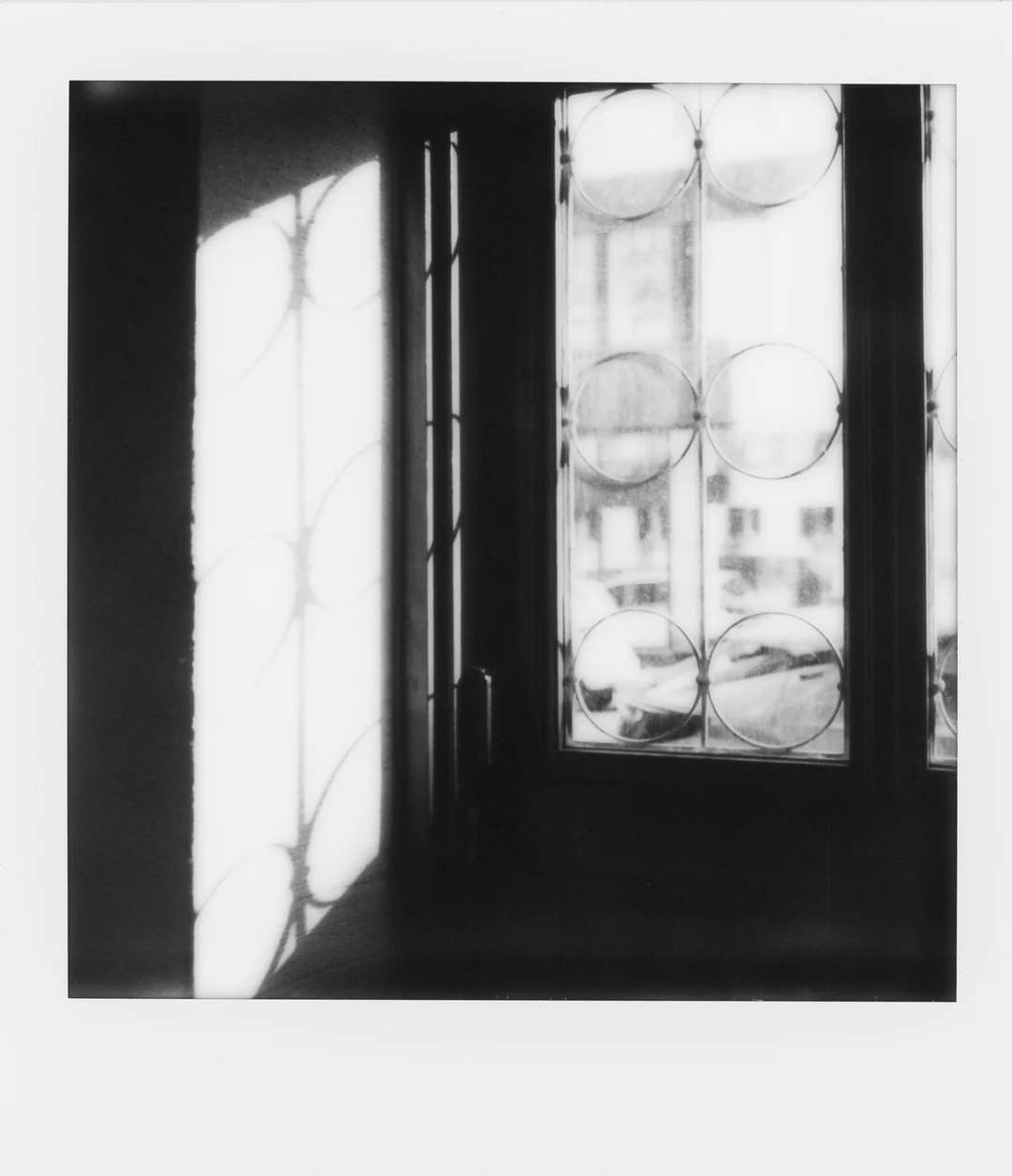 Light in a doorway (converted SX-70) | Scrolller