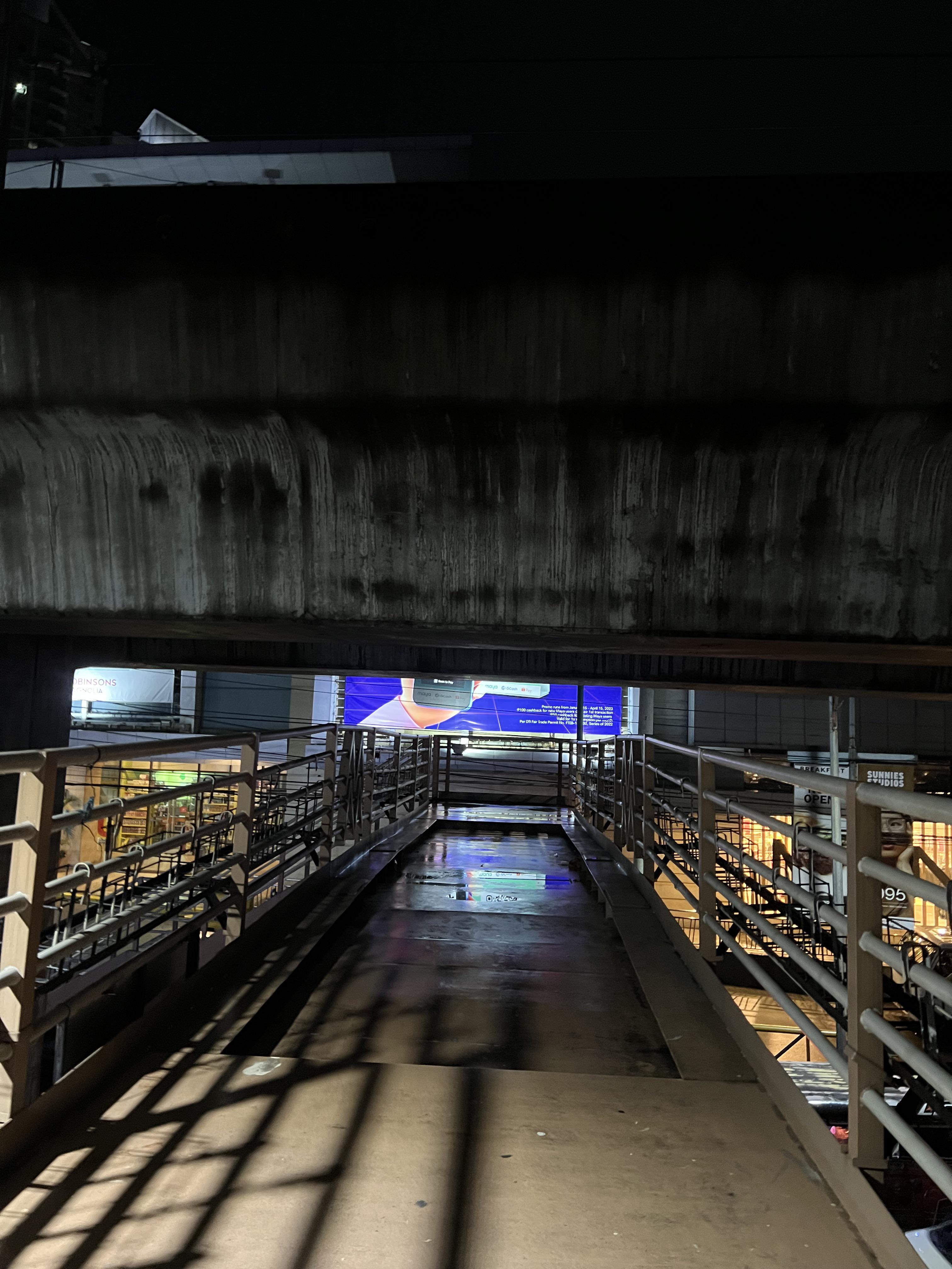 Footbridge under a railway in Manila | Scrolller