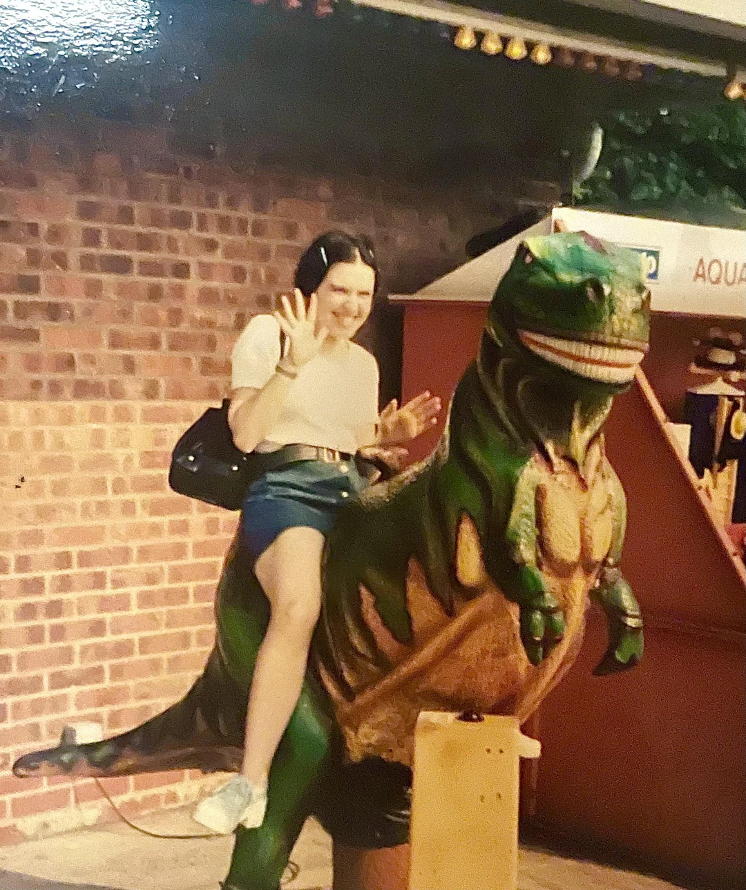 My mum riding a dinosaur sometime in the mid 1990s | Scrolller