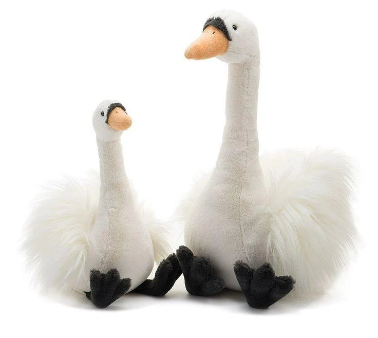 White Stuffed Swans | Scrolller