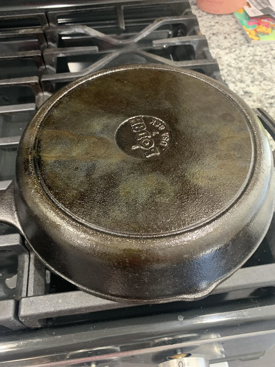 Weird green layer on bottom side of skillet. Cleaned and oiled everyday, what is and how to get ...