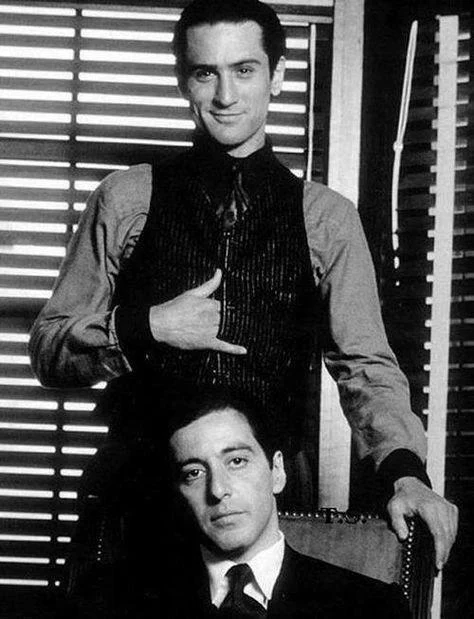 Robert DeNiro and Al Pacino on the set of The Godfather II, 1974 | Scrolller