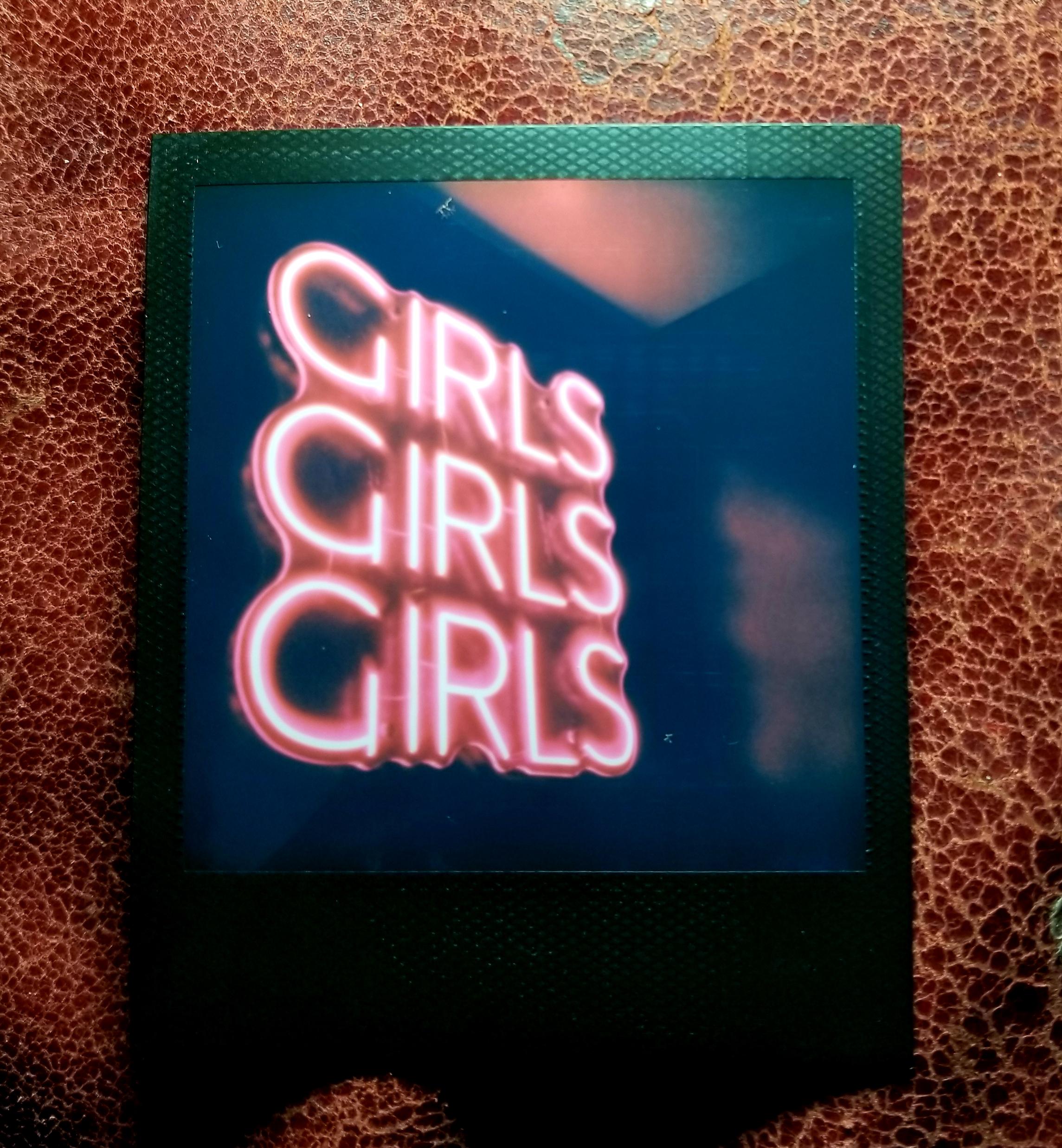 Neon sign shot in bathroom at restaurant/Polaroid Now with black frame | Scrolller