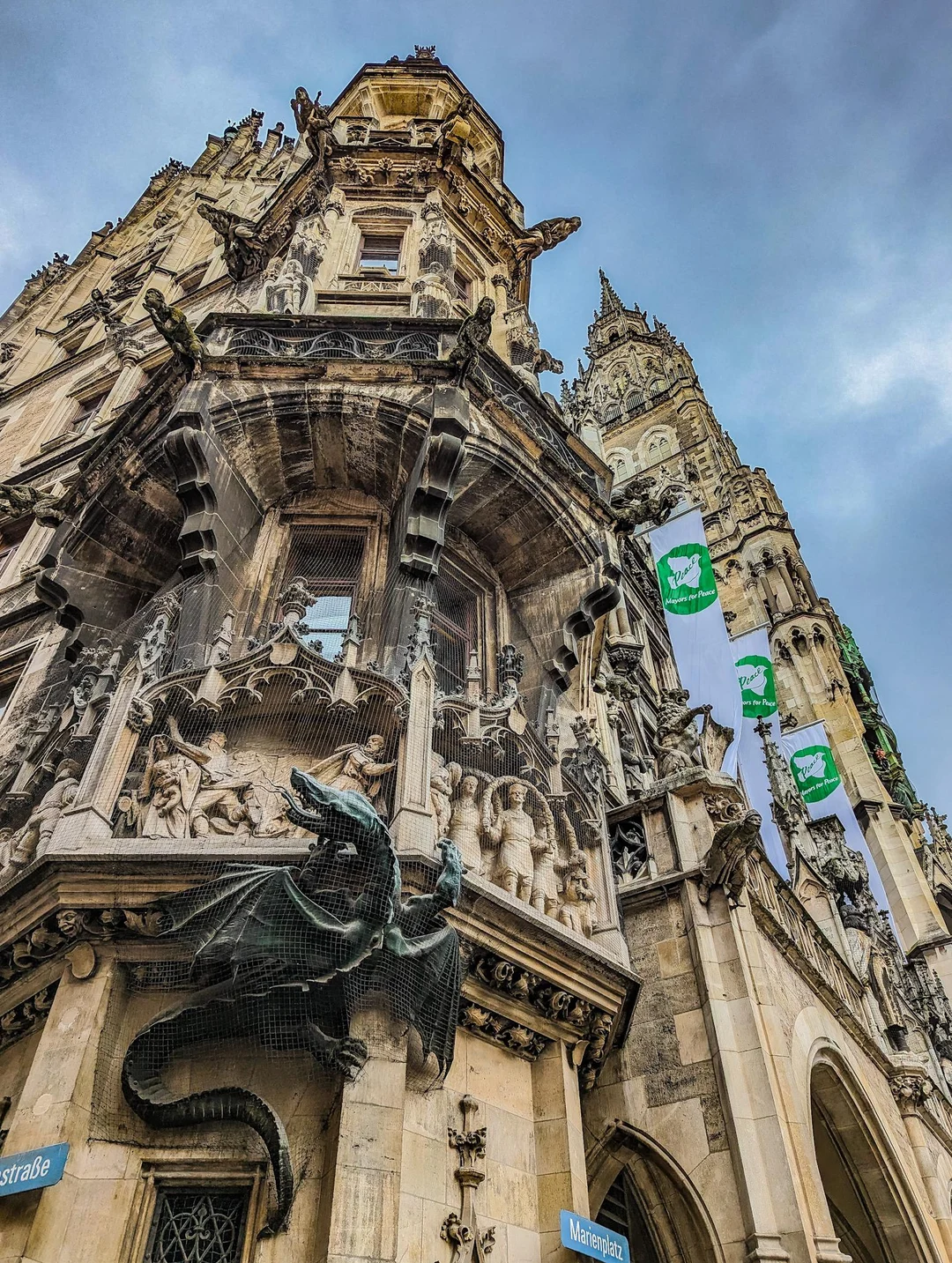 Wurmeck, A fearsome dragon clings to a corner of Munich's city hall. Marienplatz, Munich ...