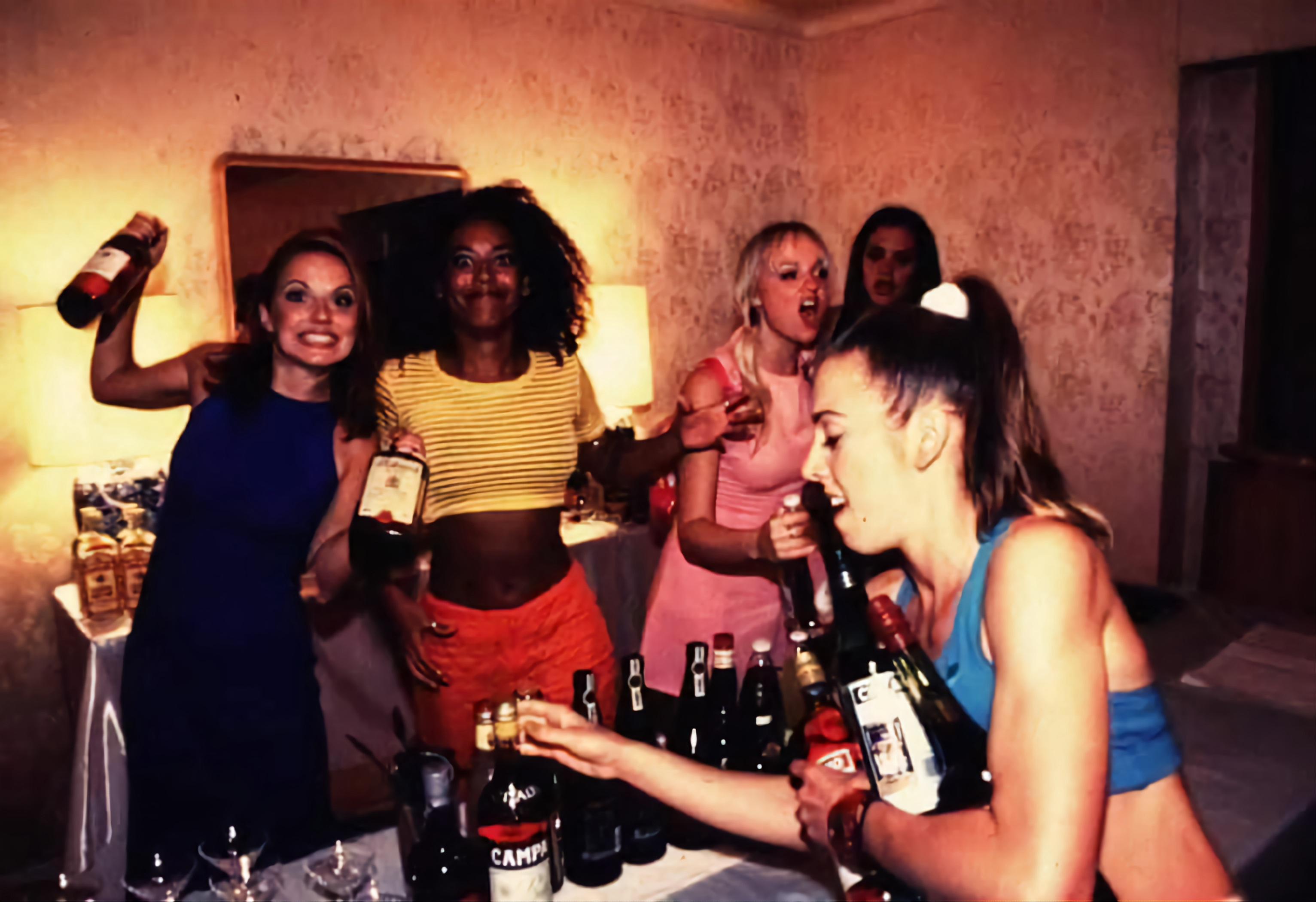 The Spice Girls backstage in 1997 | Scrolller