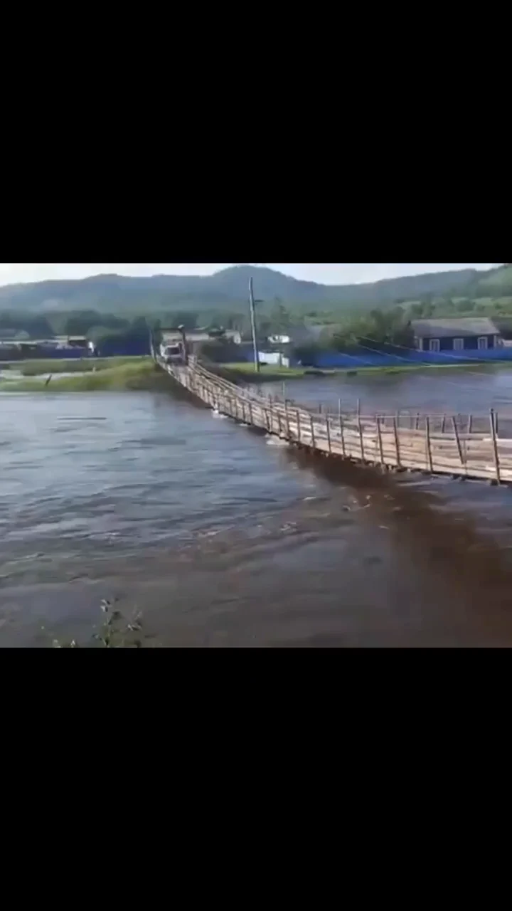 Driver tries to cross this bridge over a flooded river | Scrolller