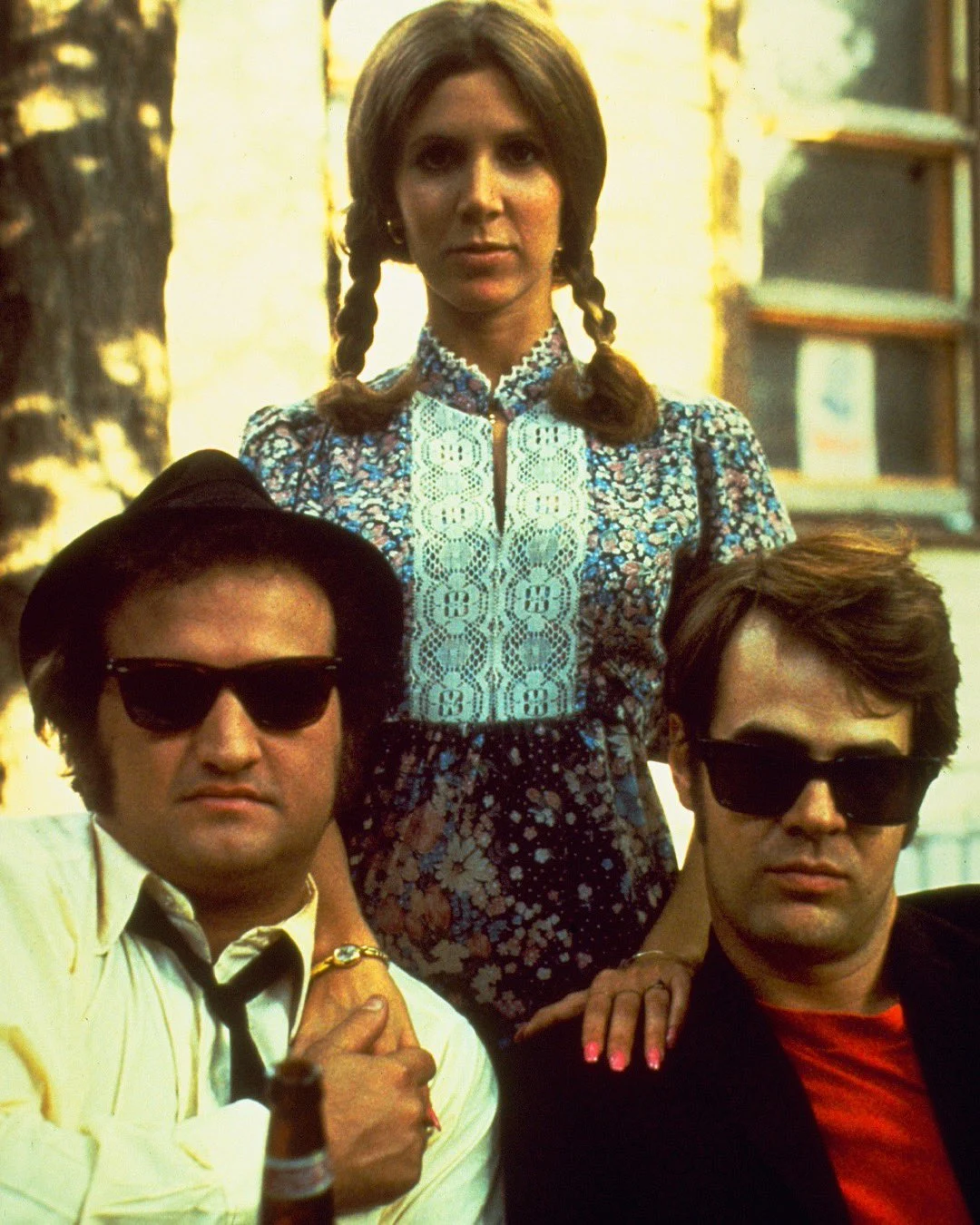 John Belushi, Carrie Fisher and Dan Aykroyd on the set of the Blues Brothers, 1980 | Scrolller