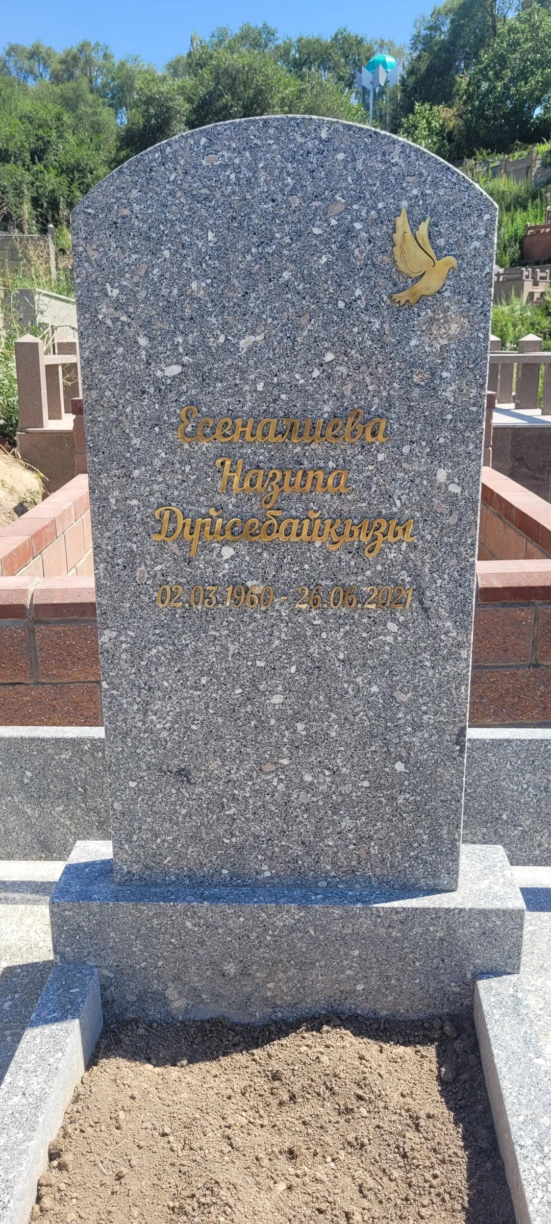 Monument from granite "Kapal-Arasan" (Produced in Kazakhstan). Letters and a dove made of brass ...