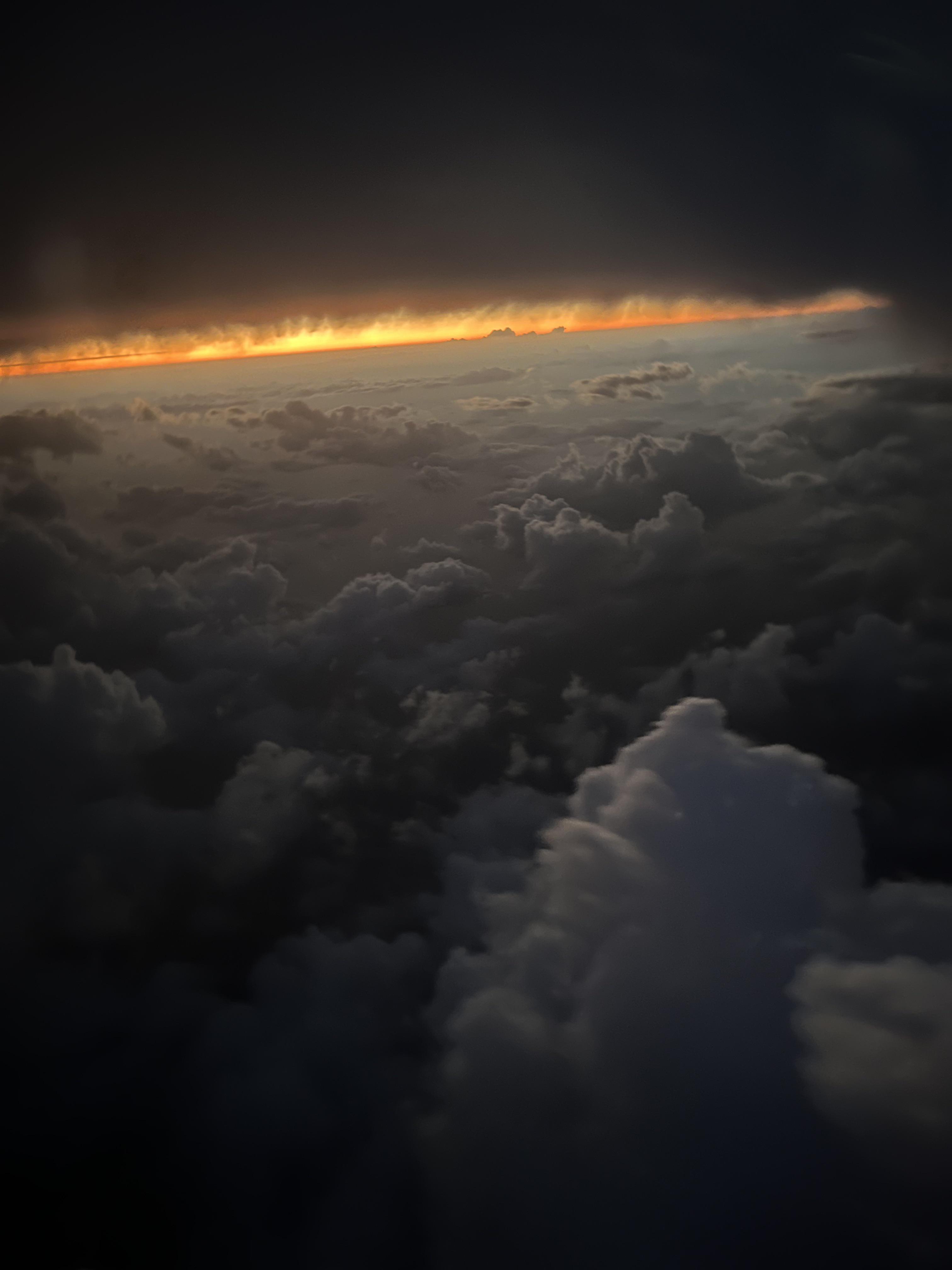 Sunset between the clouds | Scrolller
