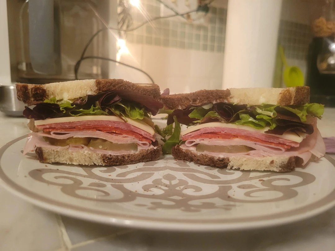 Simple ham salami pepperoni with lettuce and mayo! Not overloading the ham is key to this simple ...