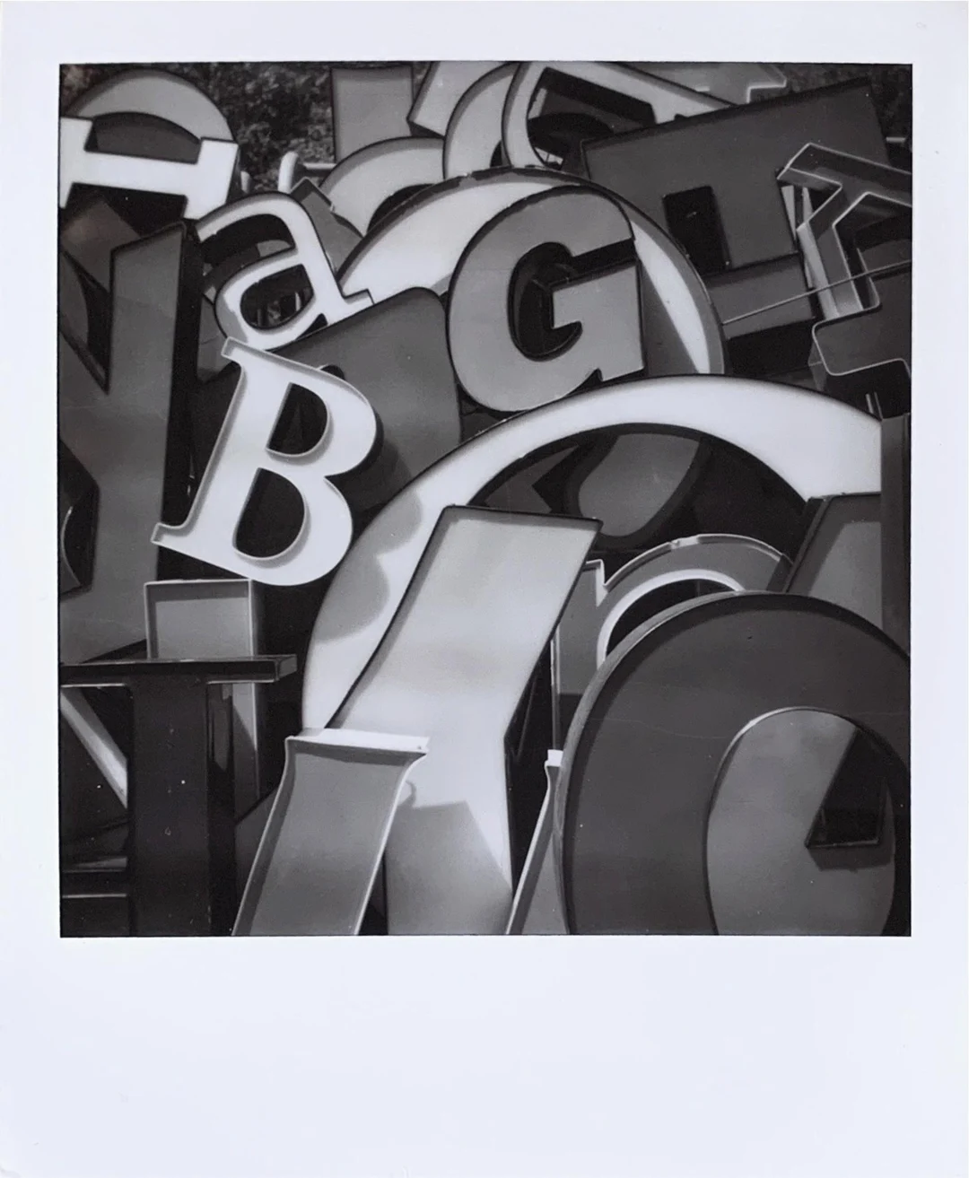 Alphabet graveyard [Pronto Sonar OneStep, SX-70 BW] | Scrolller