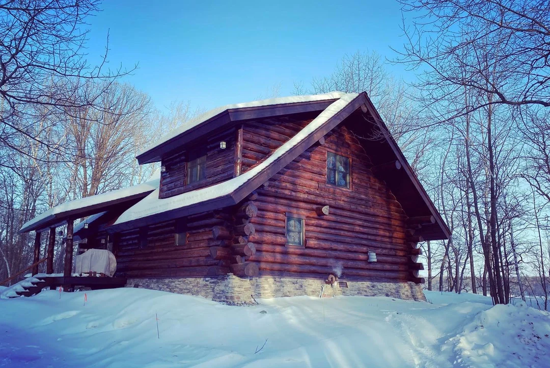 Log cabin in winter | Scrolller