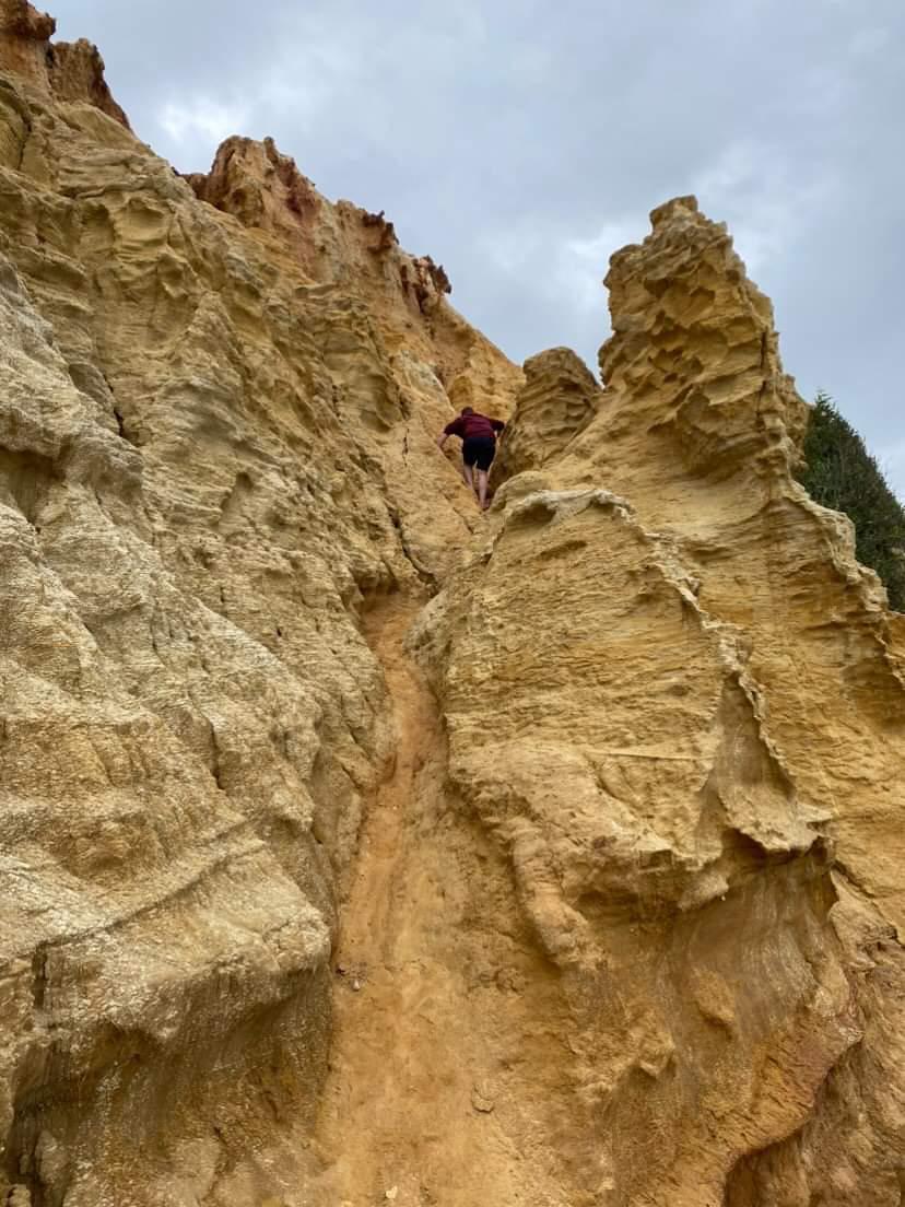 Water erosion creating pathways you can walk on up cliff face | Scrolller