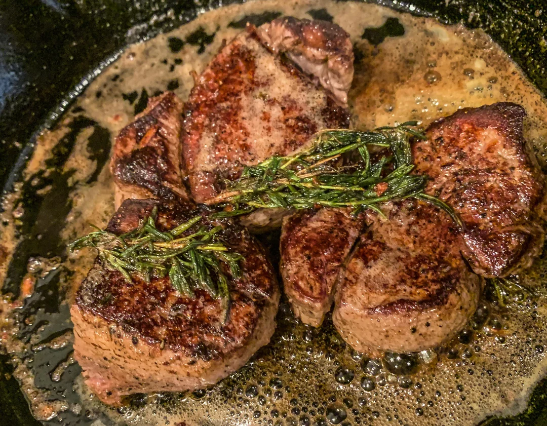 Rosemary, butter basted filets in the CI. Recipe, if you can call it that, in the comments ...