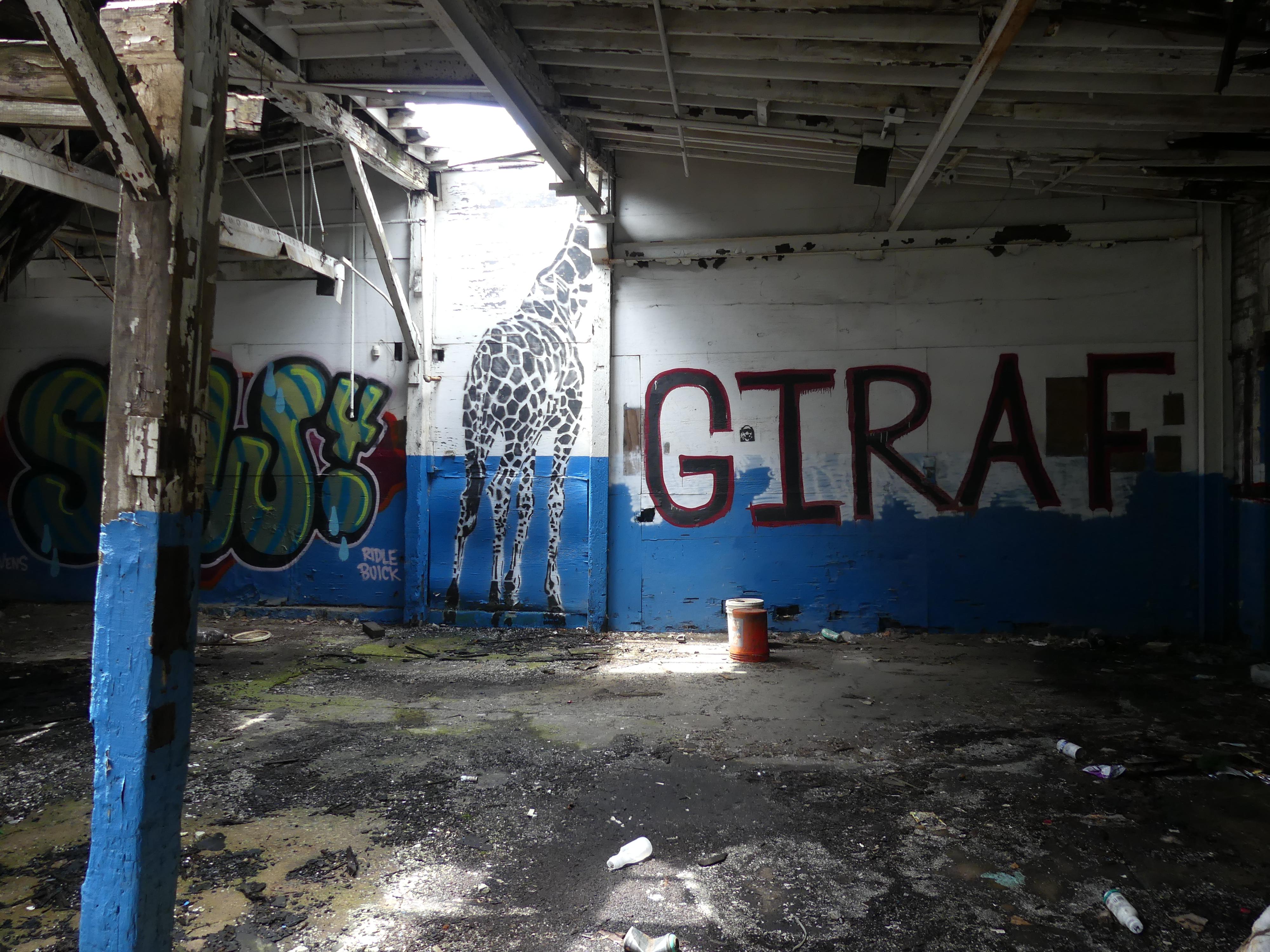 Giraffe stencil in abandoned building | Scrolller