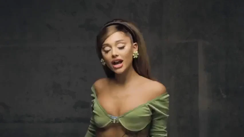 Ari singing positions in a very loose top | Scrolller