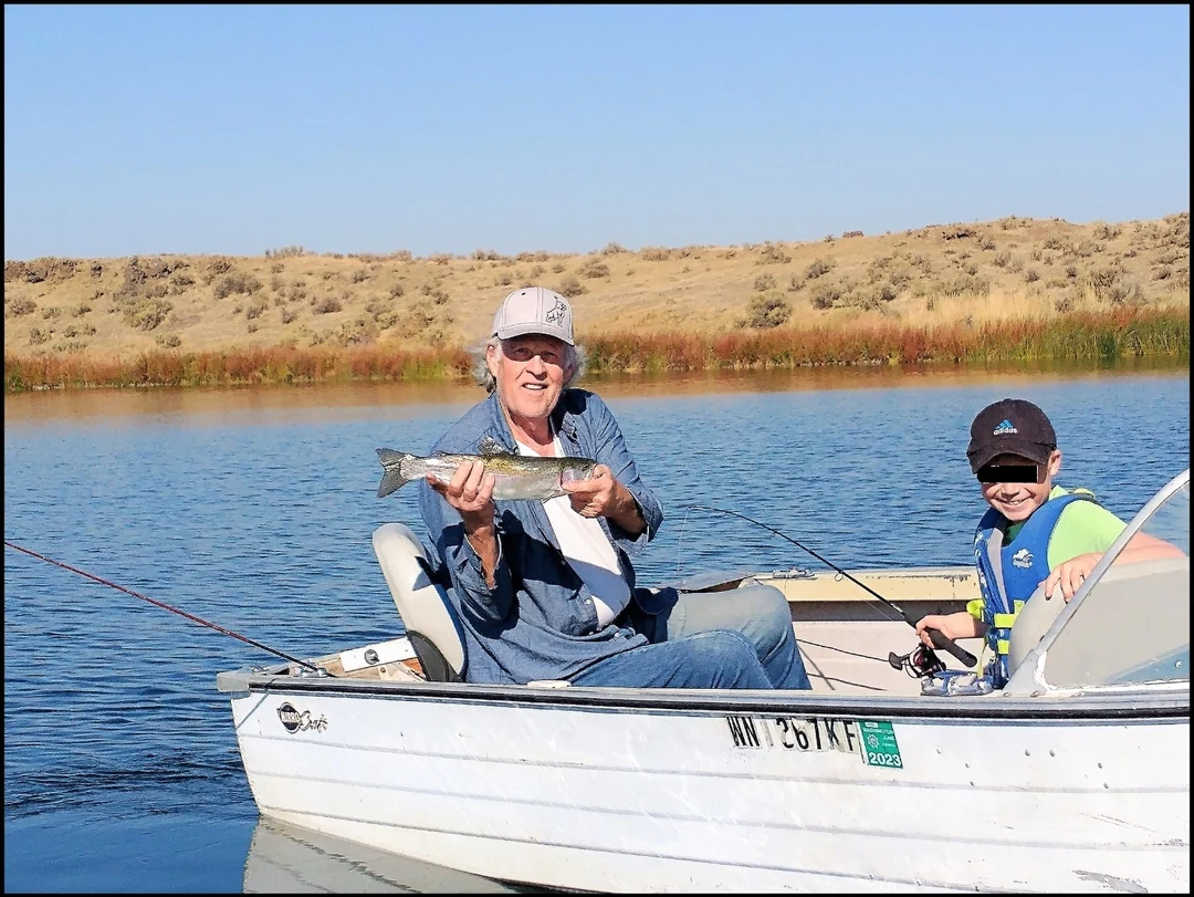 My seven year old son caught his first monster rainbow trout today while fishing with my father ...