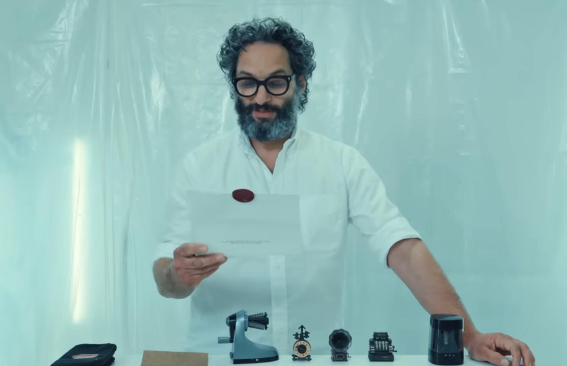 What is on the back on this task? | Scrolller