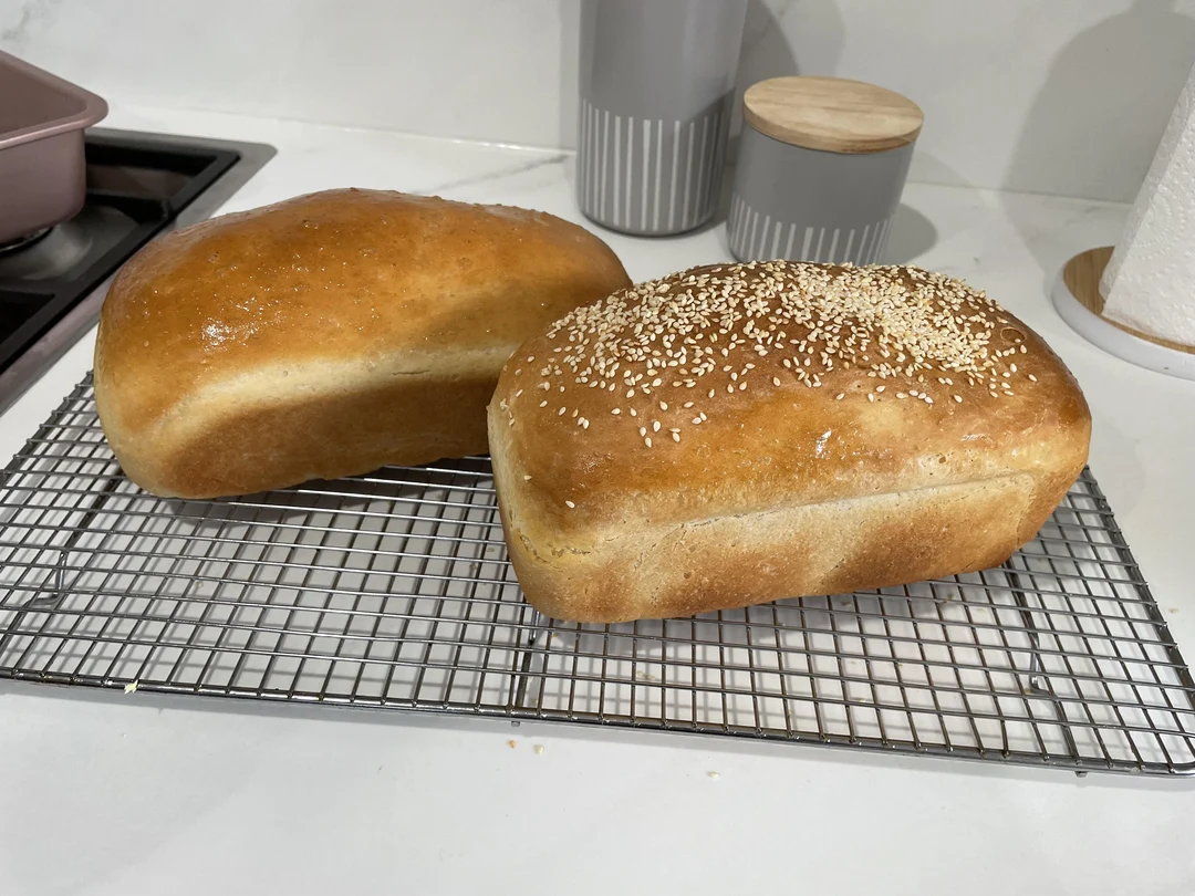 After many successful no-knead loaves, I tried my first traditional white loaves today with ...