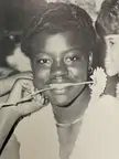 Viola Davis holding a flower during her freshman dance (late 1970s/early 1980s) | Scrolller