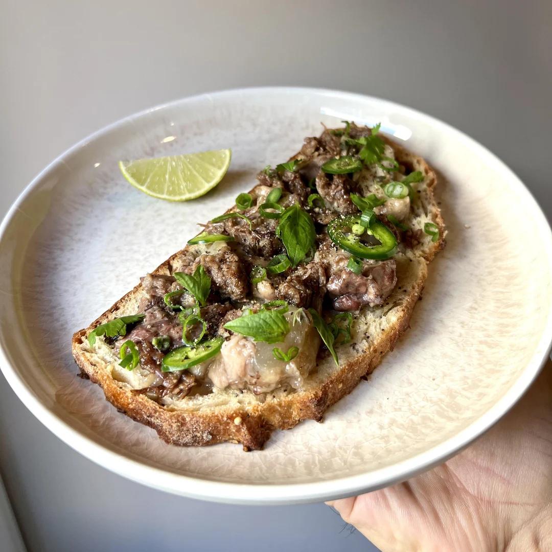 Pho Inspired Bone Marrow Toast. Bone meat and marrow topped with pho garnishes | Scrolller
