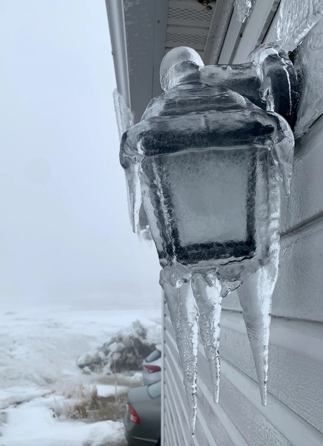 My porch light after a freezing rain storm. | Scrolller