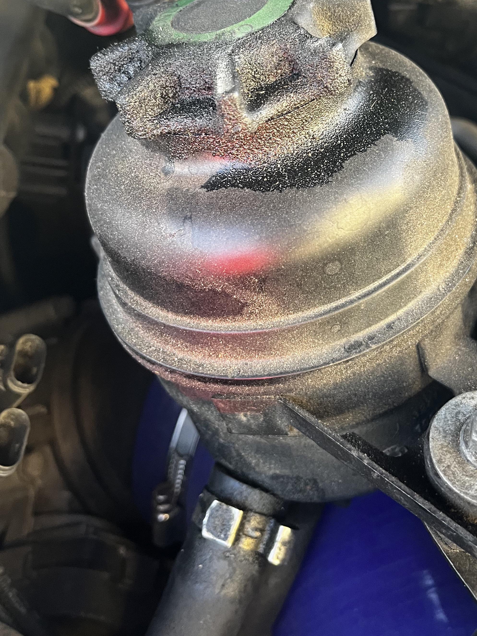 Is it little too much Power steering gunk?? Look where the hose ...